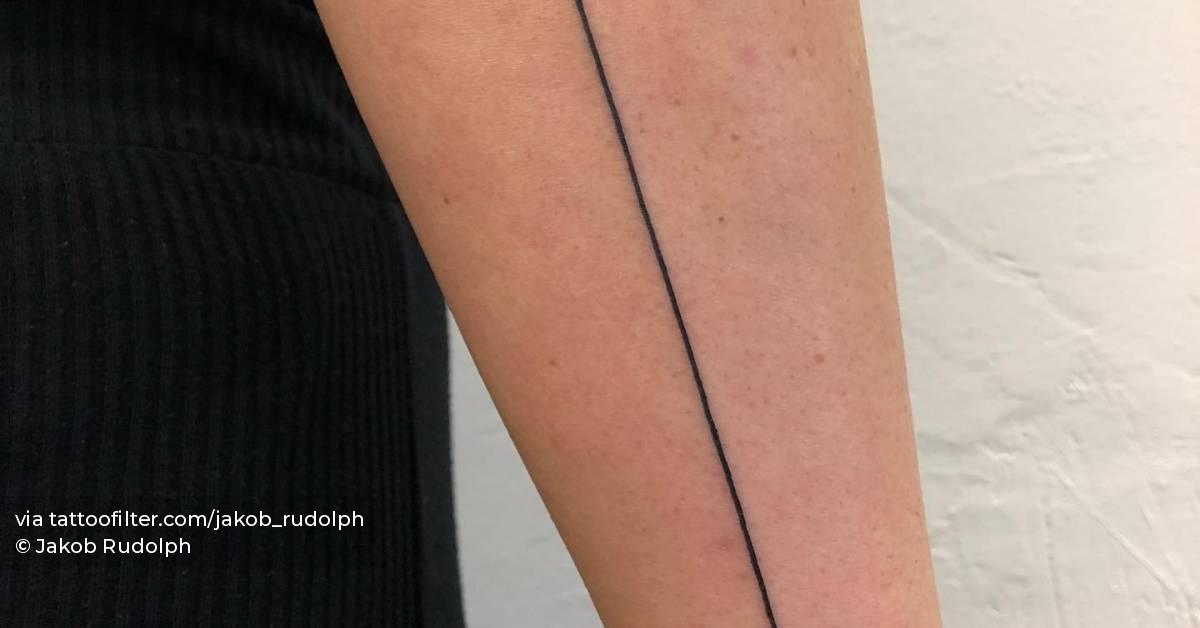 Line tattoo located on the forearm, minimalistic style.