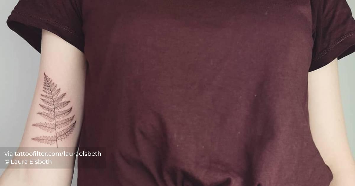 Fern frond tattoo done on the inner arm.