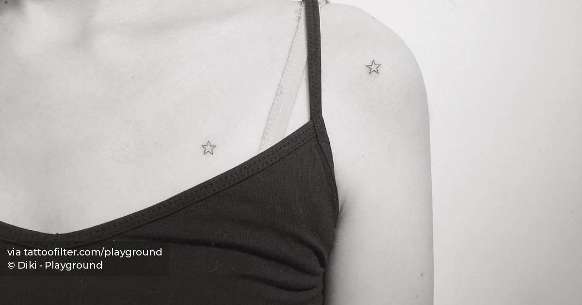 Minimalistic style stars tattooed on the chest and