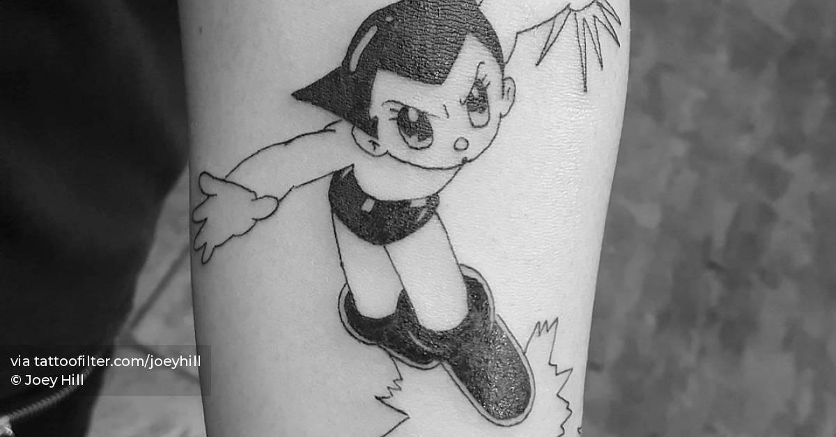 Astro Boy tattoo located on the inner forearm.