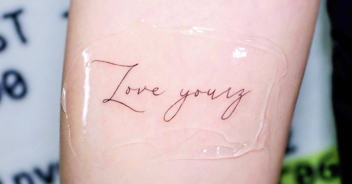 "Love yourz" lettering tattoo located on the inner