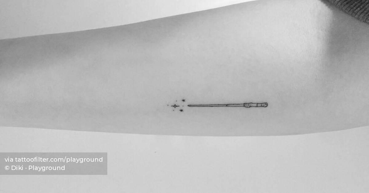 Minimalistic Harry Potter wand tattoo located on the
