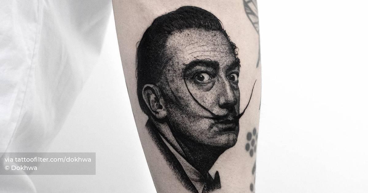 Salvador Dali tattoo located on the forearm.