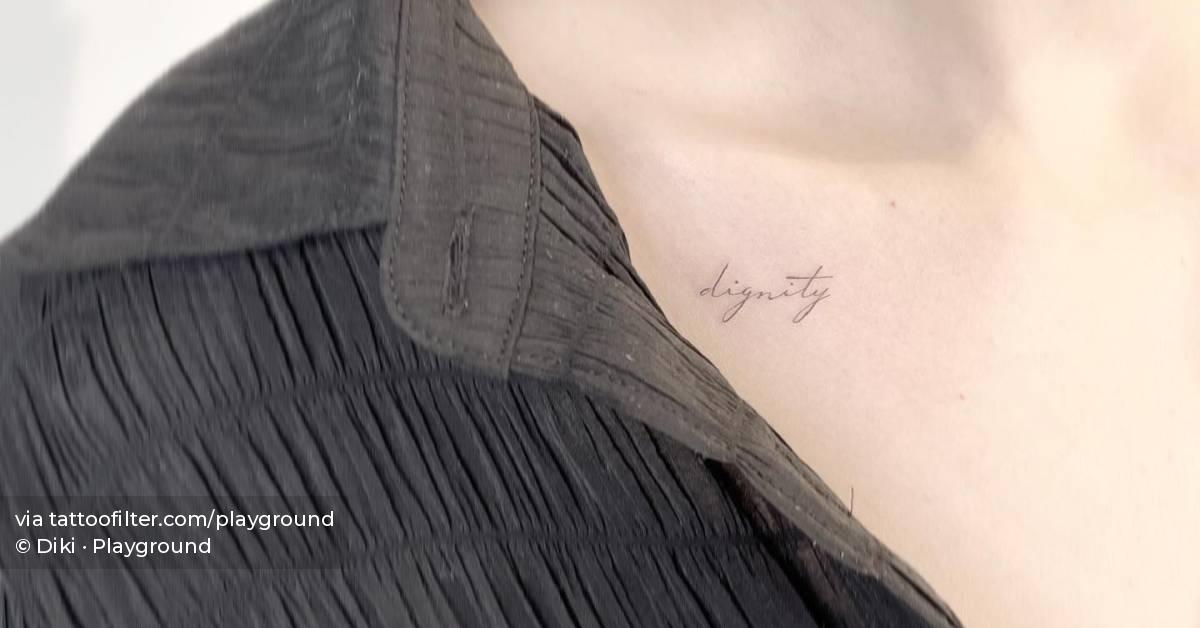 "Dignity" lettering tattoo located on the collarbone.
