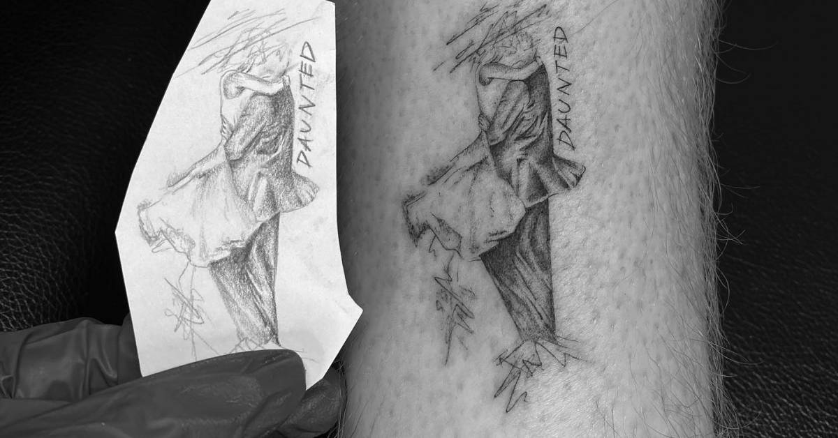 Hug tattoo located on the ankle, sketch work style.