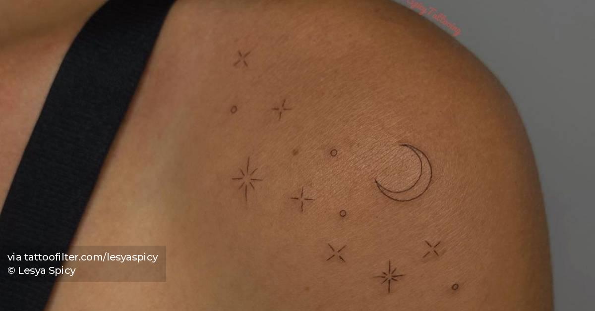 Fine line stars and moon tattoo located on the