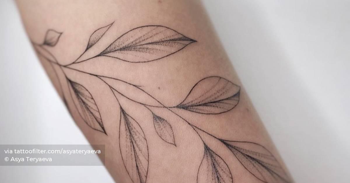 Leaves tattoo located on the inner arm.