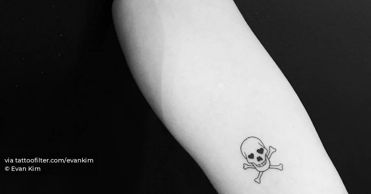 Jolly Roger tattoo located on the inner arm,