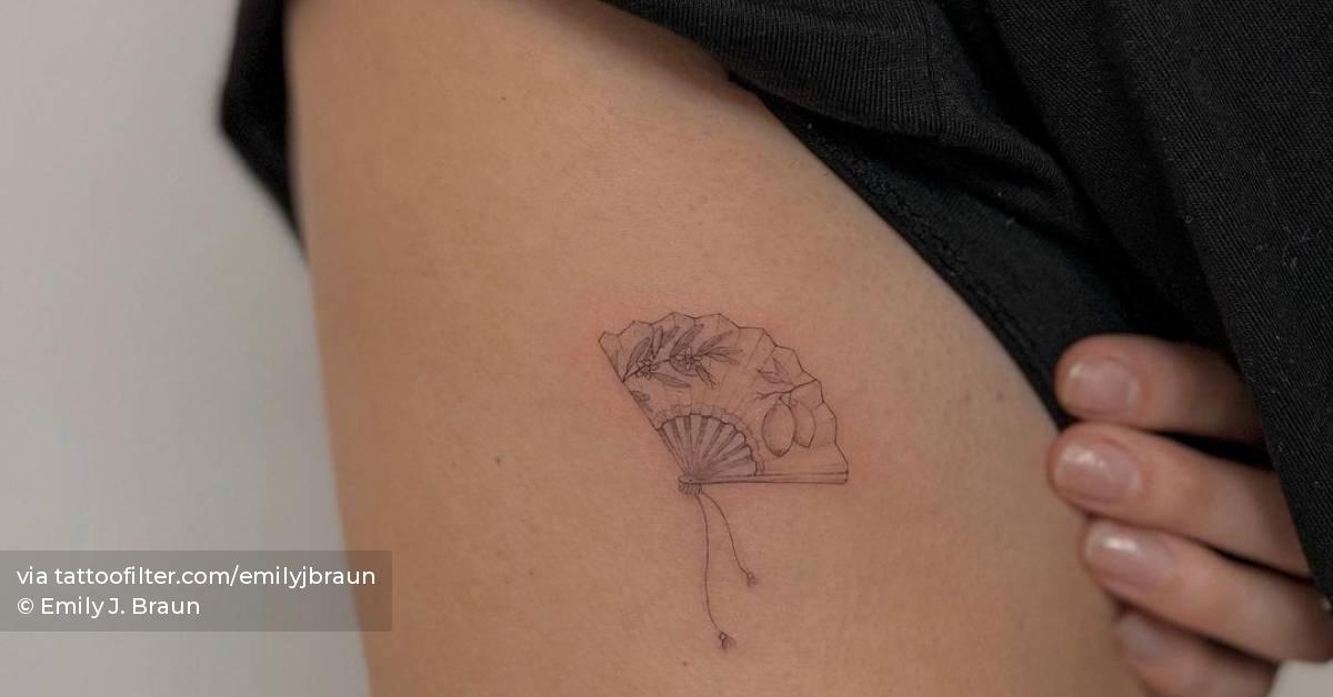 Single needle hand fan tattoo located on the side boob.