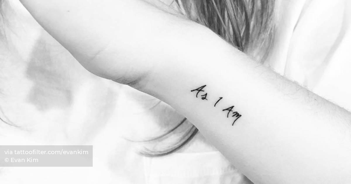 "As I Am" lettering tattoo located on the wrist.