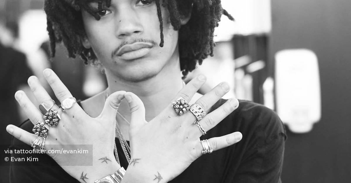 Individual matching flying swallows tattooed on Luka