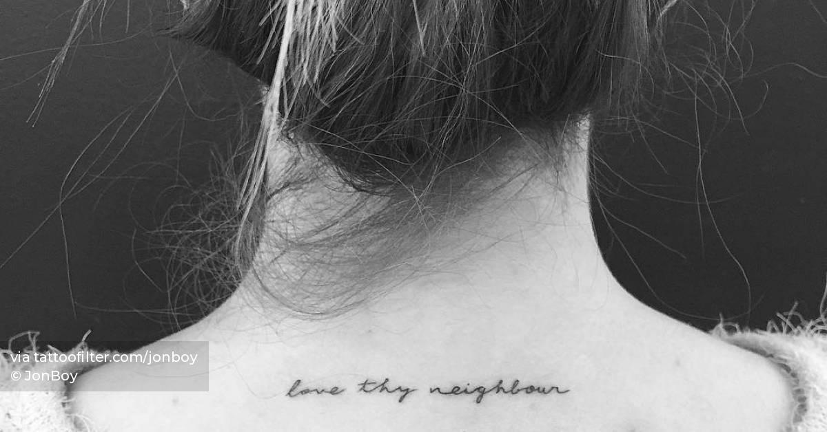 Tattoo that says "love thy neighbour" handwritten on