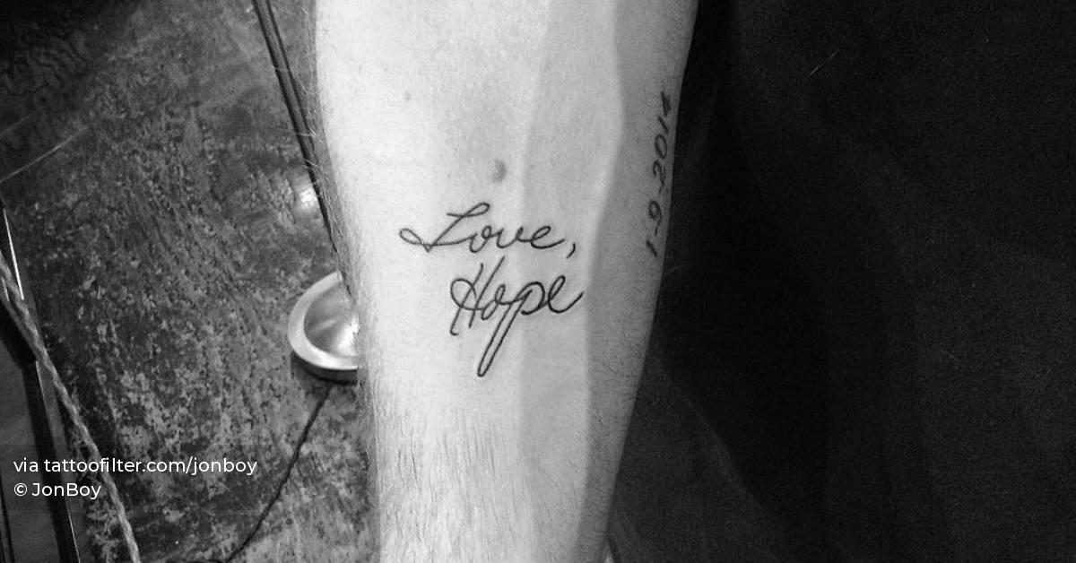 "Love, Hope" lettering tattoo located on the inner