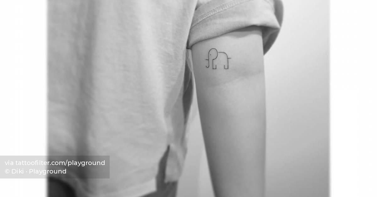 Tiny minimalistic elephant tattoo placed on the inner