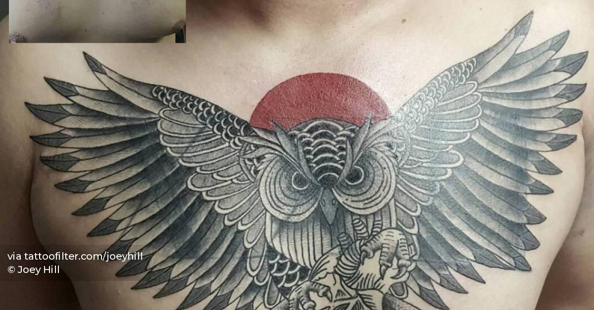 Owl cover up tattoo located on the chest.