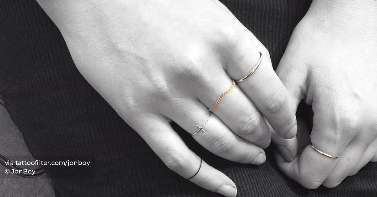 Minimalistic style ring tattoo.