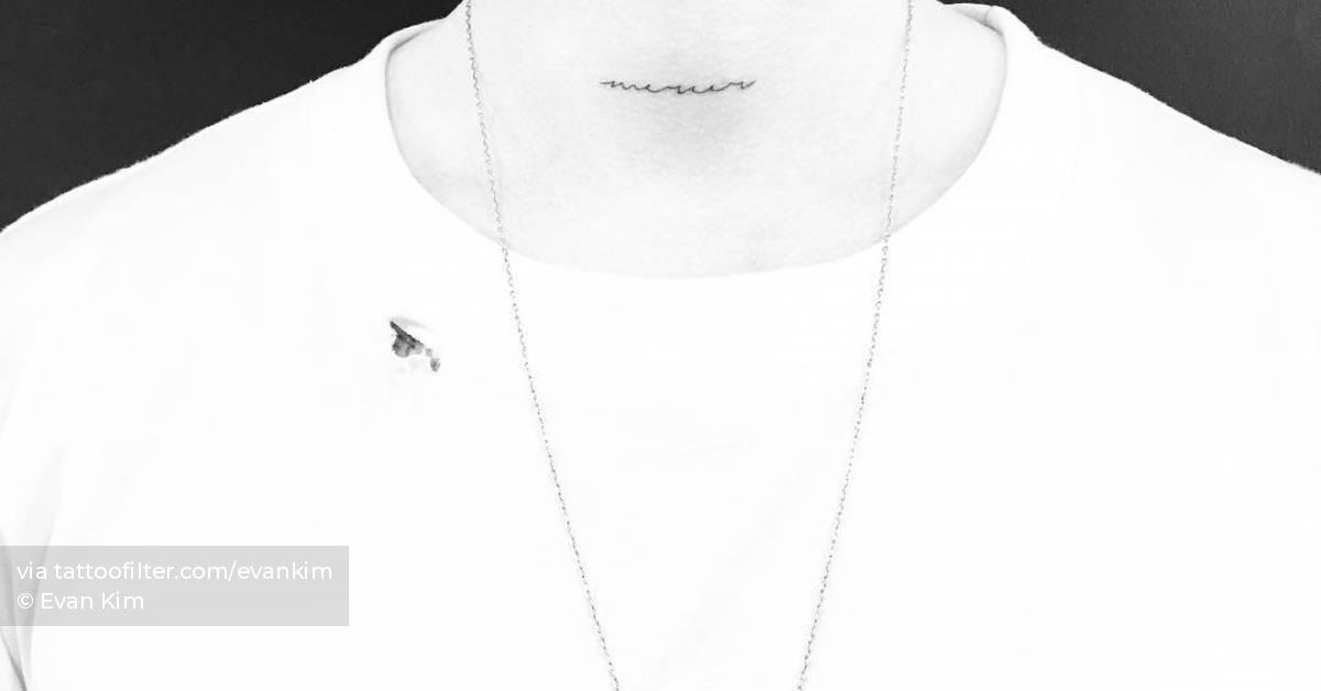 "Mercer" lettering tattoo located on the throat.