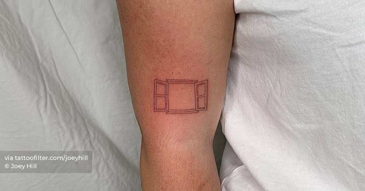 FIne line window tattoo placed on the upper arm.