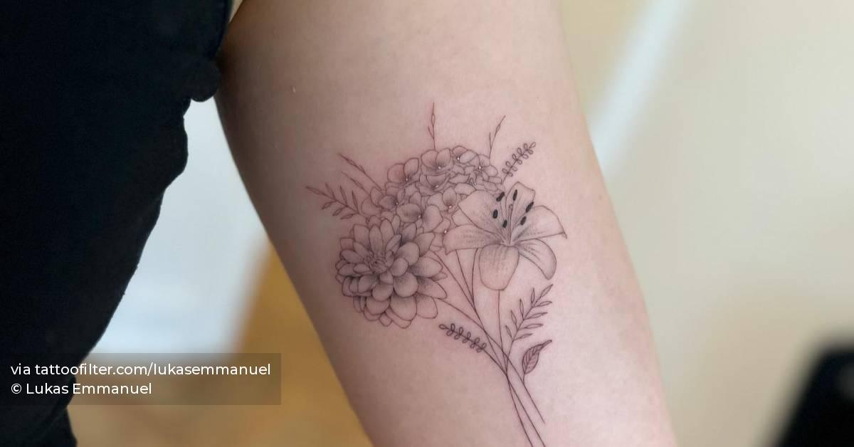 Flower bouquet tattoo done on the inner arm.