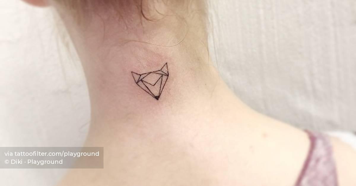 Low poly fox portrait tattoo located on the back of the