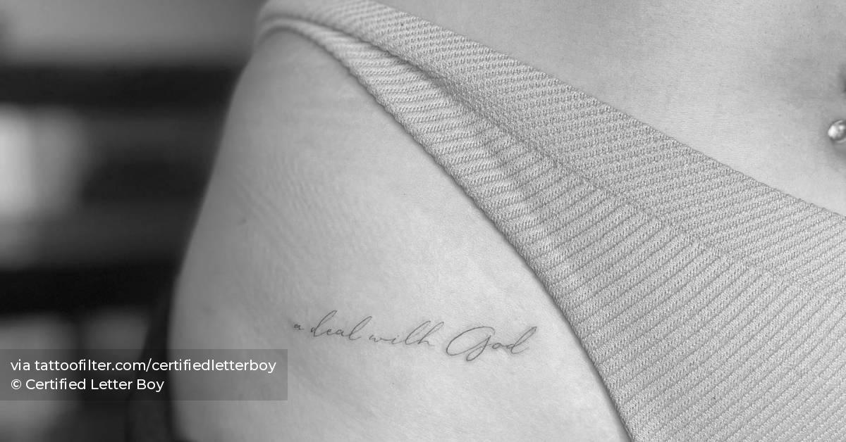 "A deal with God" lettering tattoo placed on the