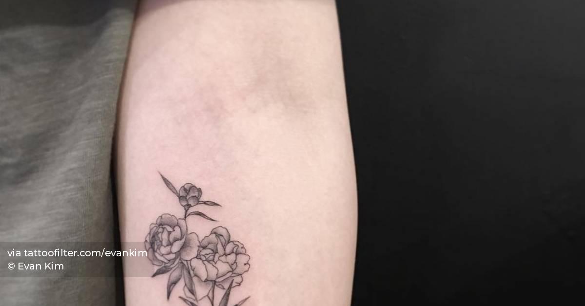 Peonies tattoo located on the inner forearm,