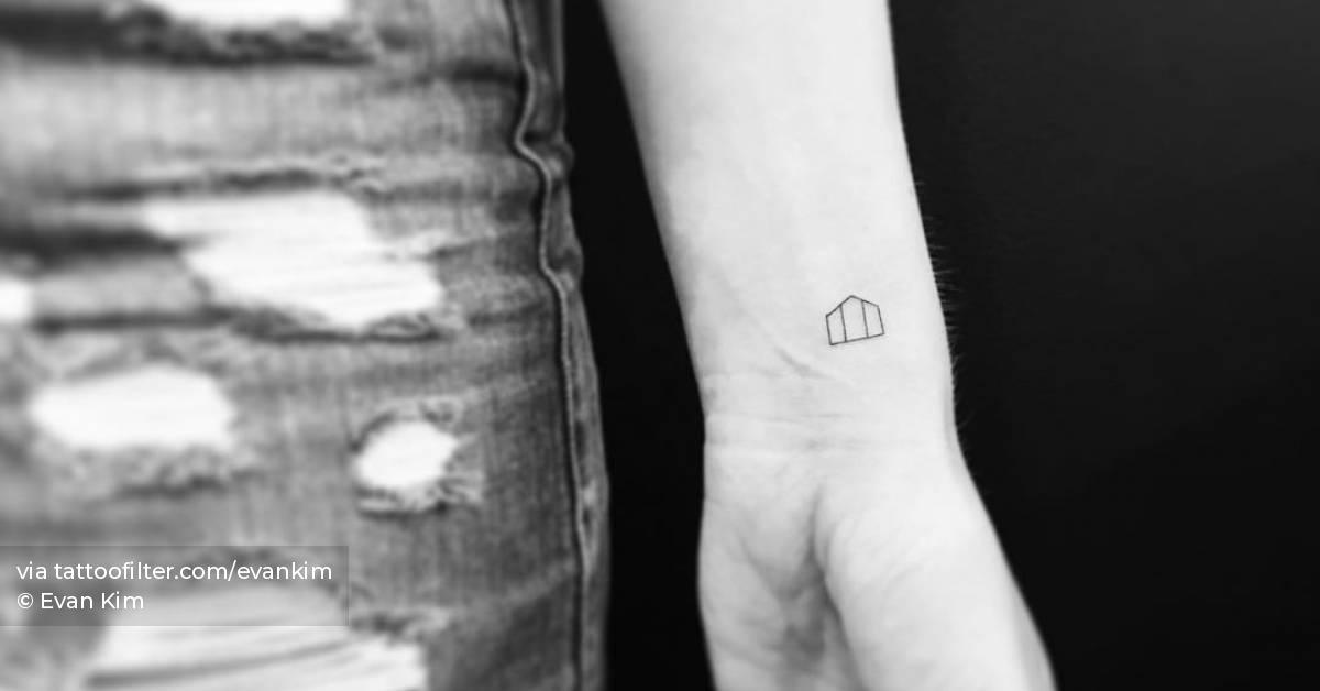 Minimalistic style house tattoo located on the wrist.