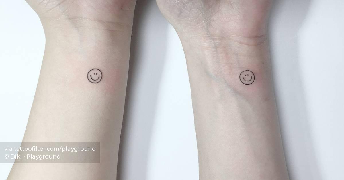 Matching smiley face tattoo for best friends,