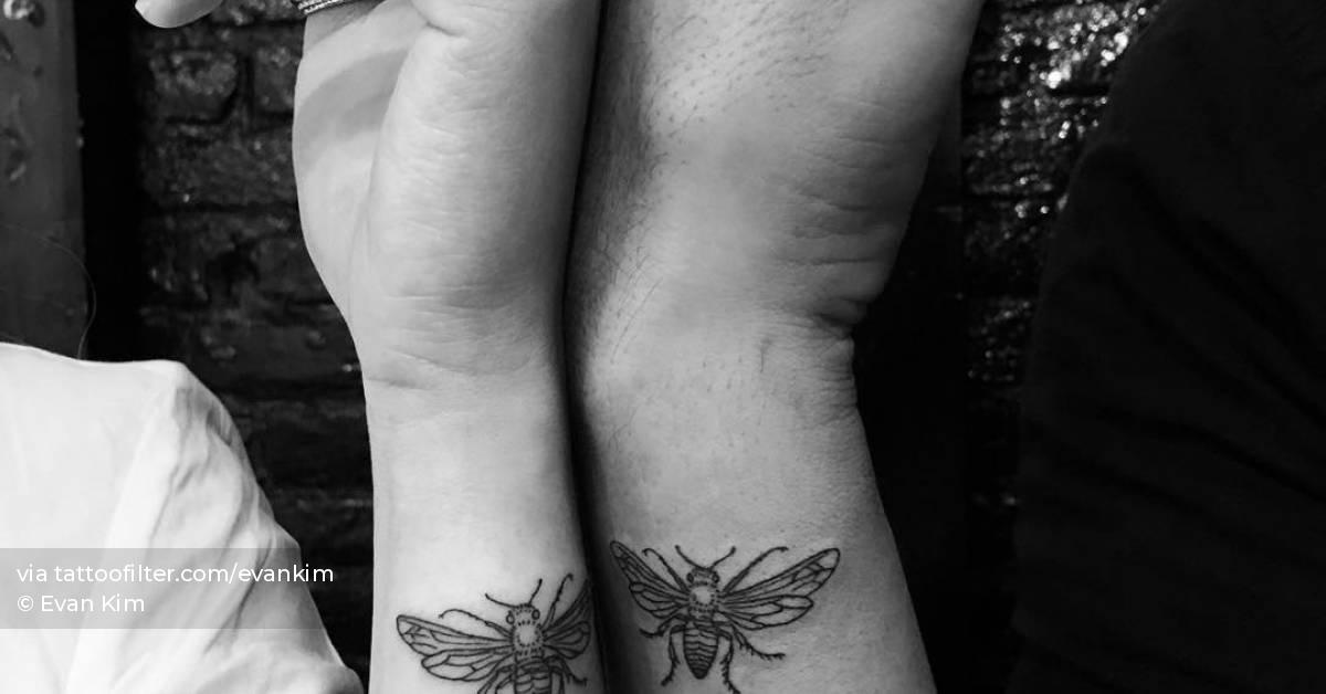 Matching bee tattoo for couple.
