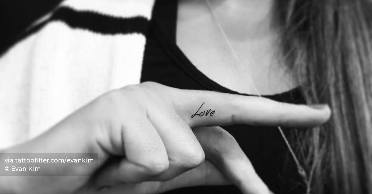 Tattoo of the word "love" done on the finger.