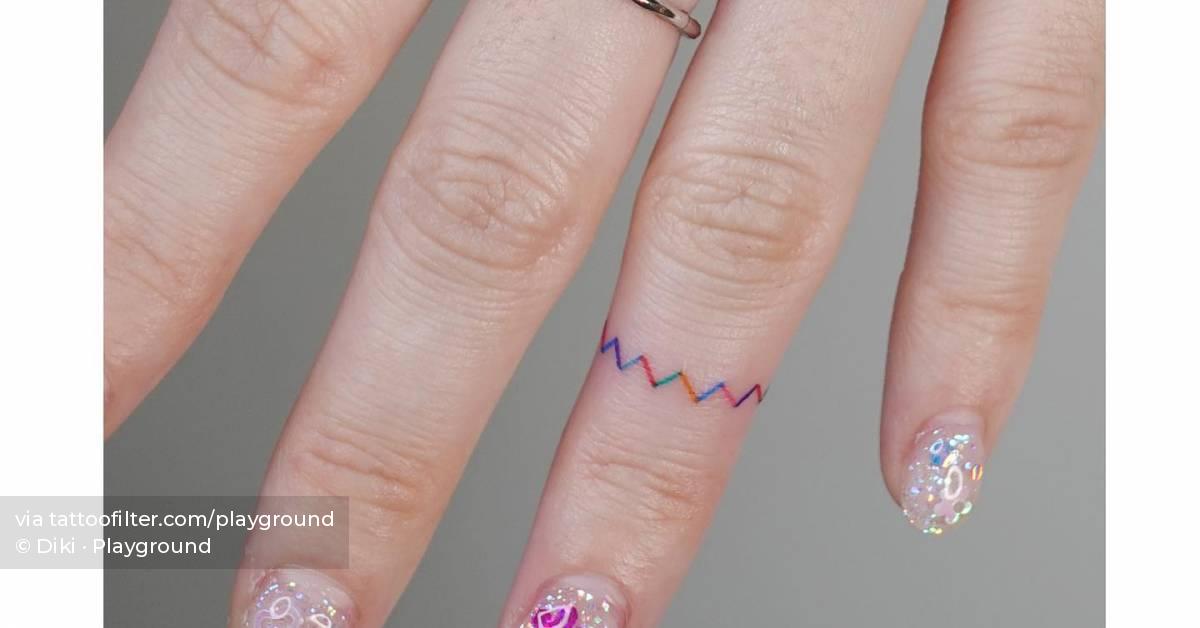 Colorful minimalistic ring tattoo.