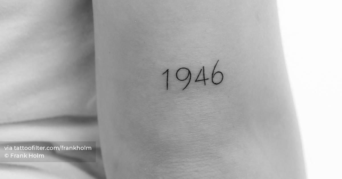 "1946" tattoo placed on the tricep.