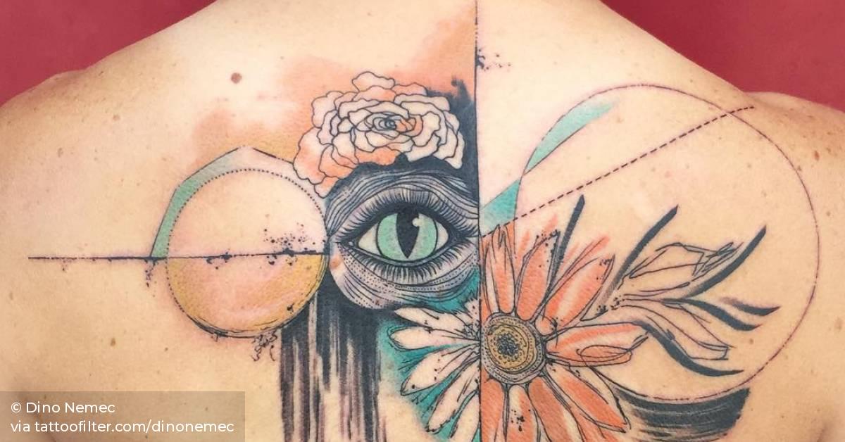 Graphic/sketch style upper back tattoo.