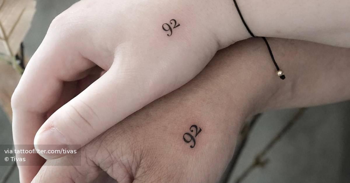 Matching number "92" tattoo for couple.