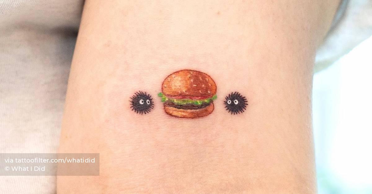 Hamburger and Soot Sprites tattooed on the bicep.