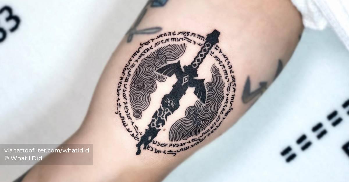 Sword from Legend of Zelda tattooed on the inner arm.