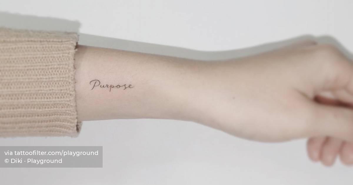 Tattoo of the word "purpose" located on the wrist.
