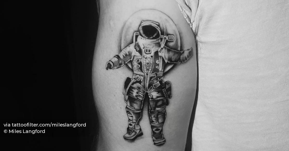 Astronaut tattoo located on the tricep, micro-realistic