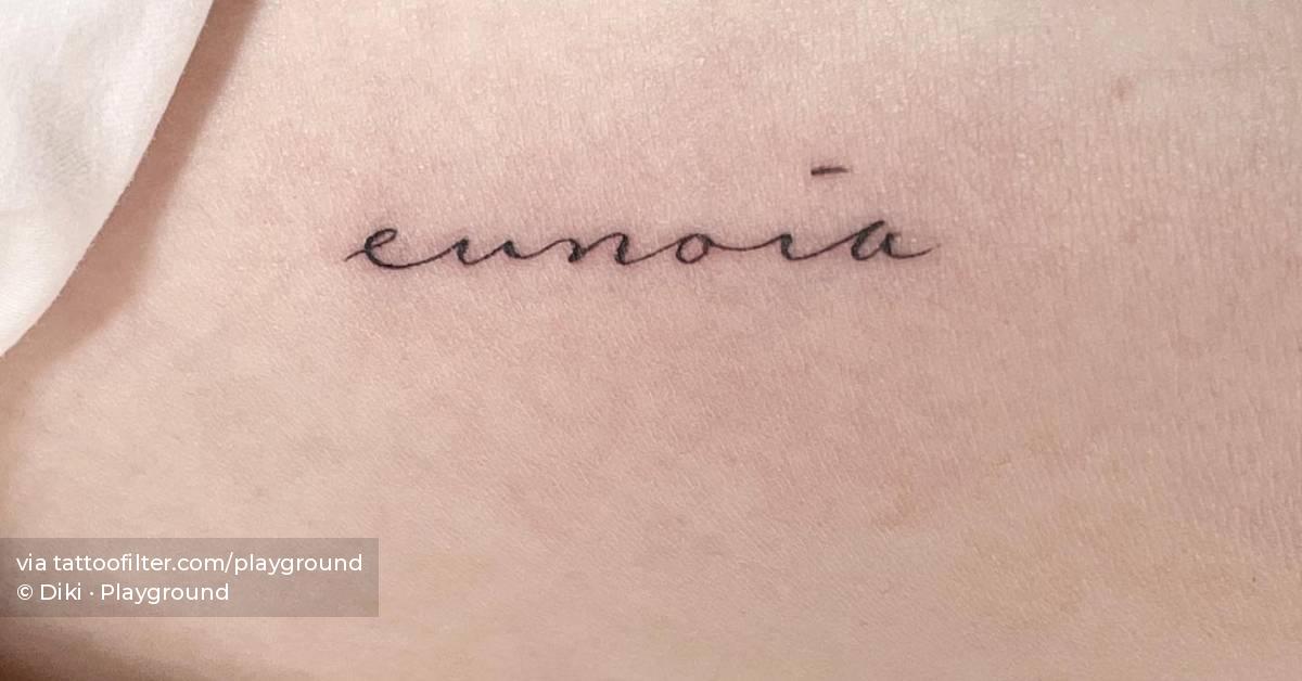 Tattoo of the word "eunoia" located on the inner arm.