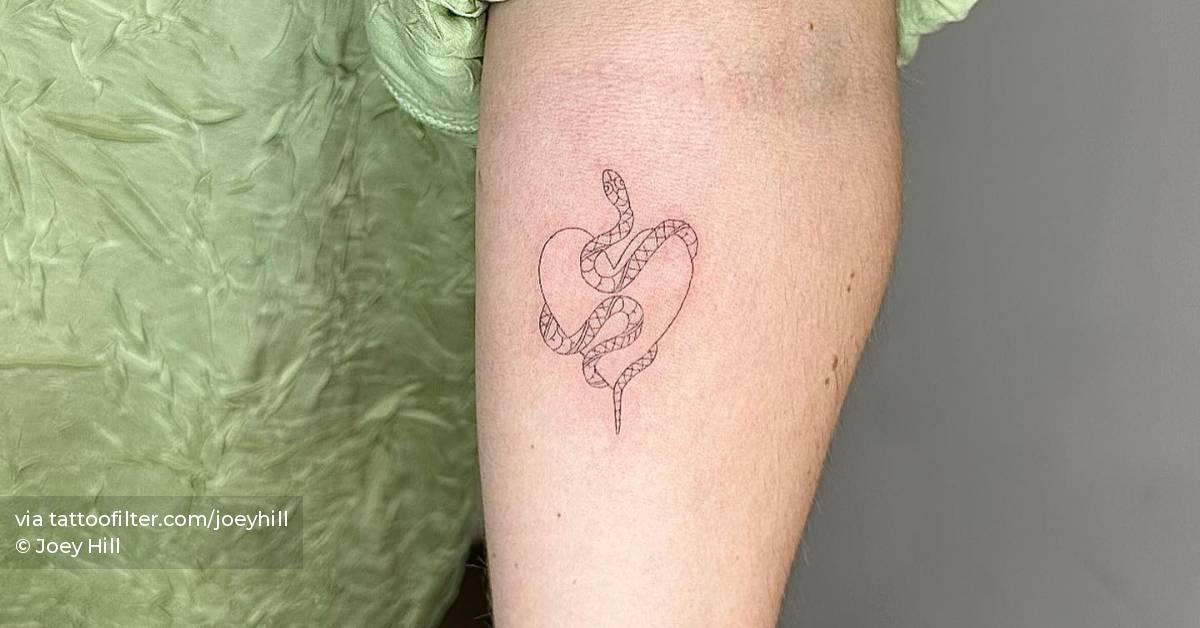 Snake and heart tattoo located on the inner forearm,