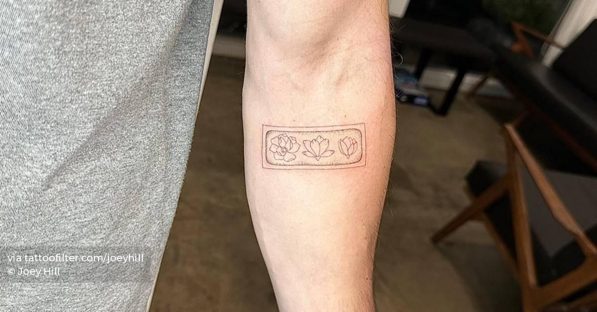 Blooming flower tattoo located on the inner forearm.