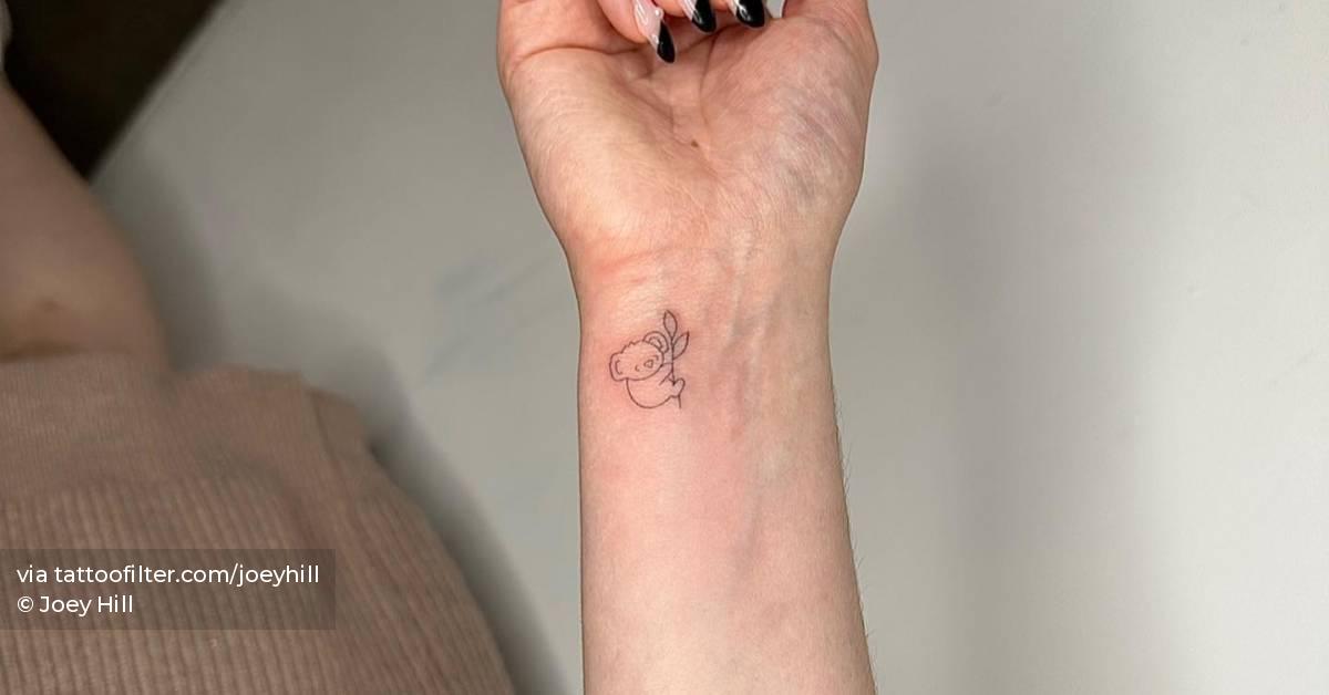 Fine line style koala tattooed on the wrist.