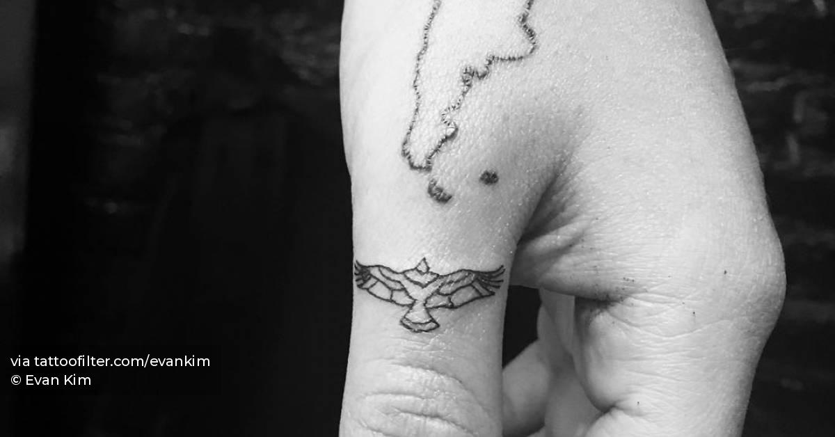 Tiny minimalistic style condor tattoo located on the
