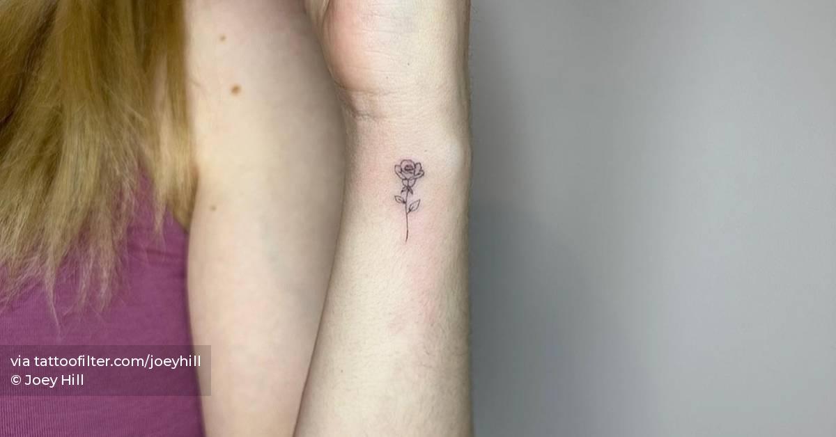 Fine line style rose tattoo done on the wrist.