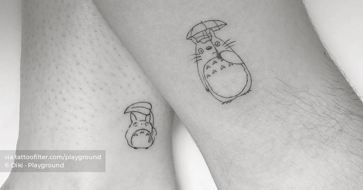 Matching Totoro tattoo for couple.