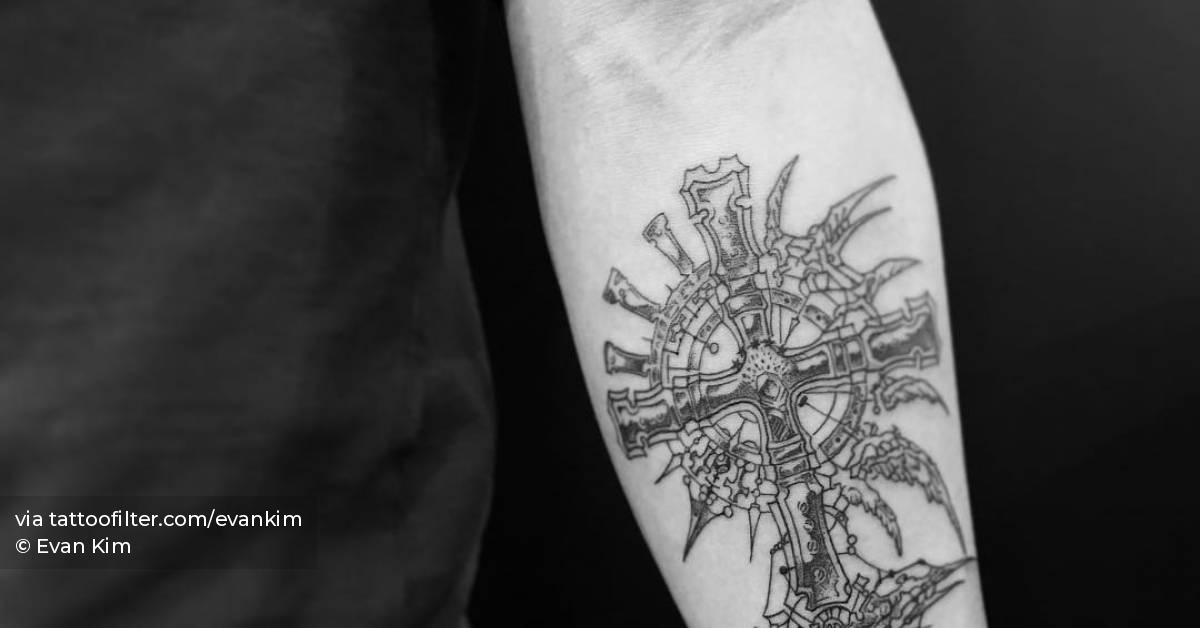 Trinity Blood tattoo located on the inner forearm.