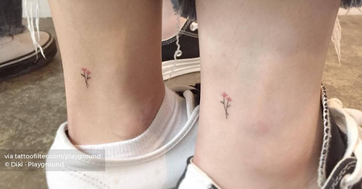Matching minimalistic flower tattoo for best friends.