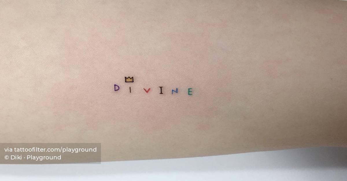 Colorful tattoo of the word "divine" and a little
