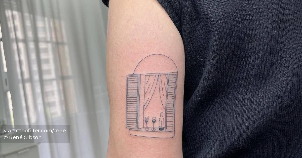 Fine line style window tattoo done on the tricep.
