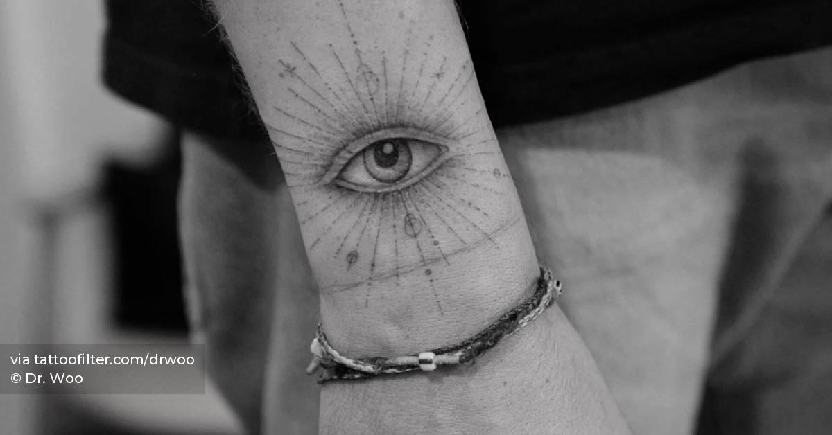 Single needle eye tattoo located on the wrist.